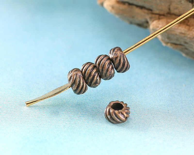 Antiqued Brass (plated) Small Twisted Rondelle 2x3.5mm